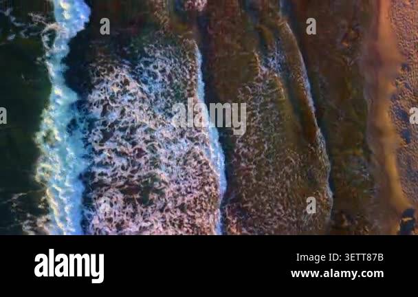 Stunning top-down drone footage capturing clear turquoise and dark ...