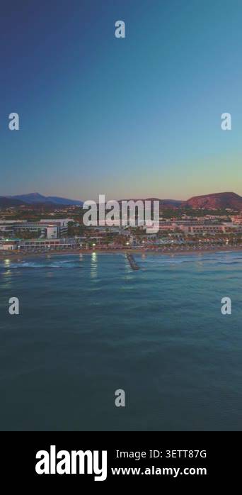 Vertical cinematic drone footage flying over calm mediterranean sea ...