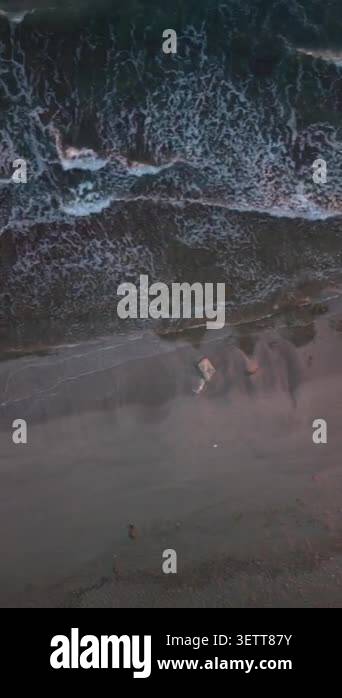 Vertical top-down drone footage capturing mediterranean sea waves ...