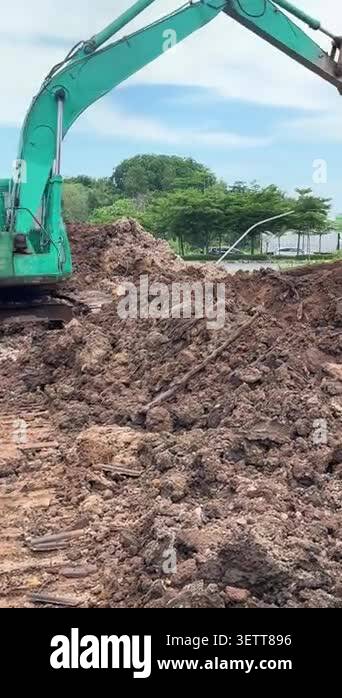 excavator digging the hole in the ground. digging the soil Stock Video ...
