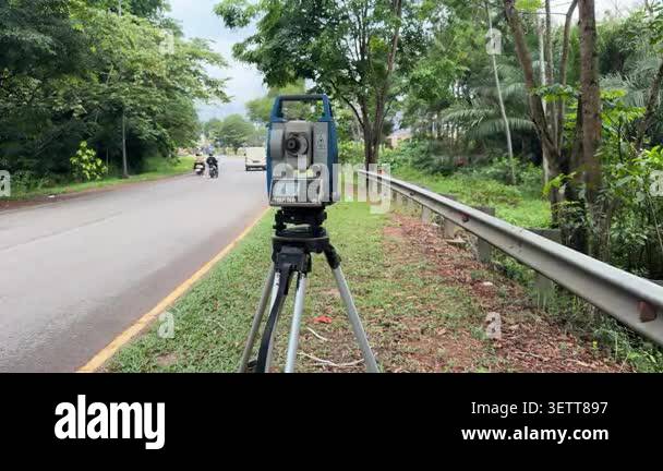 Digital total station deployed for meticulous land assessment near a ...