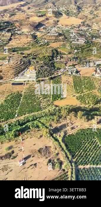 Views of Malaga Spain during a flight show green fields and landscape ...