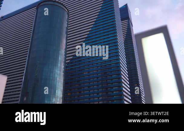 Low angle view of a modern high-rise building with a smooth glass ...