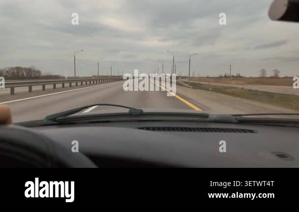 Pov shot from inside a car driving on an asphalt highway through the ...