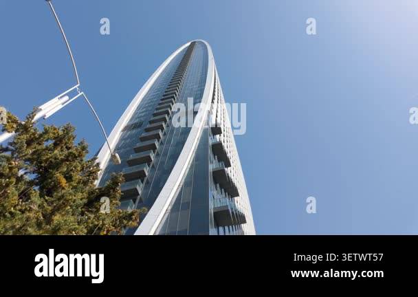 Low angle view of a contemporary residential skyscraper with a unique ...