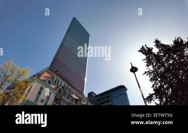 Modern skyscraper standing against a clear blue sky on a bright sunny ...
