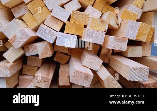 Close-up top view of numerous wooden blocks creating a dynamic abstract ...