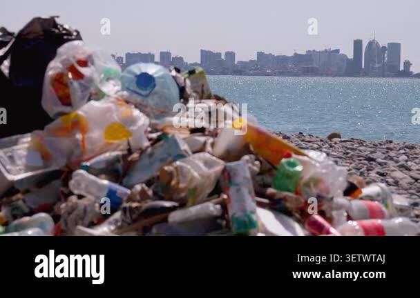 Heaps of plastic bottles and other non-degradable waste contaminating a ...
