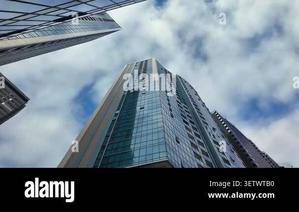 Modern city skyscrapers with glass facades reflecting the blue sky ...