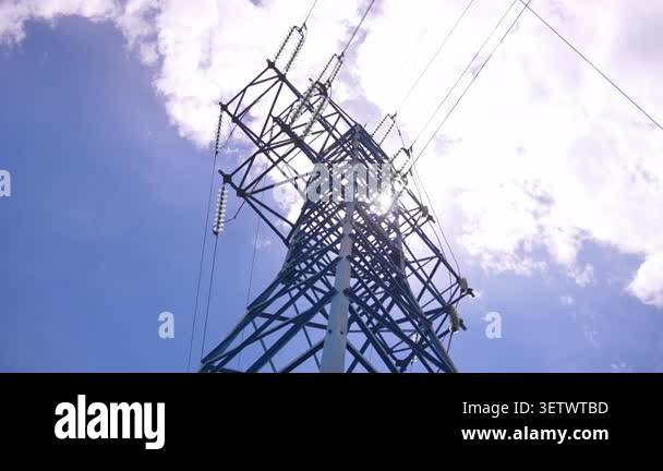 Tall steel lattice pylon carrying high-voltage electricity lines ...