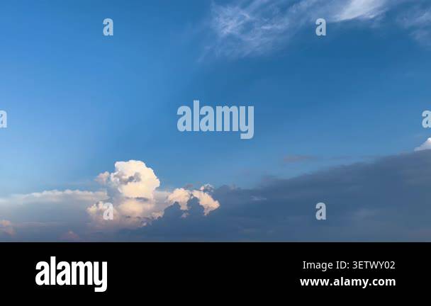 Beautiful Blue Sky with Majestic White Cumulus Clouds and Soft Sunlight ...