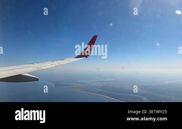 RIGA, LATVIA - MAY 7, 2022: A 4K aerial passenger-window view from a ...