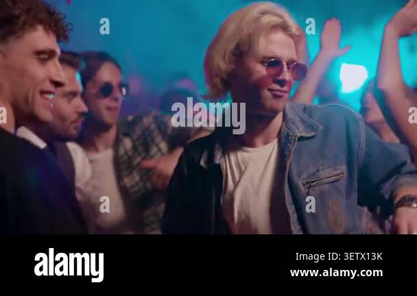 The video shows a lively party where a man in sunglasses dances ...