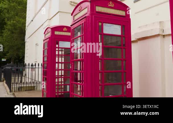 Red Telephone Booths Lined Up Outside London Building. High quality 4k ...