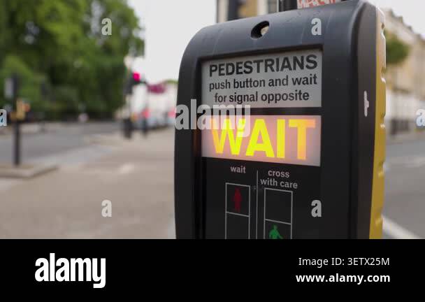 Illuminated Wait Sign On London Pedestrian Crossing Button. High ...