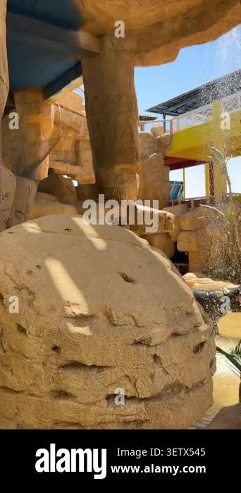 Artificial rocky water feature with waterfall an outdoor water park on ...
