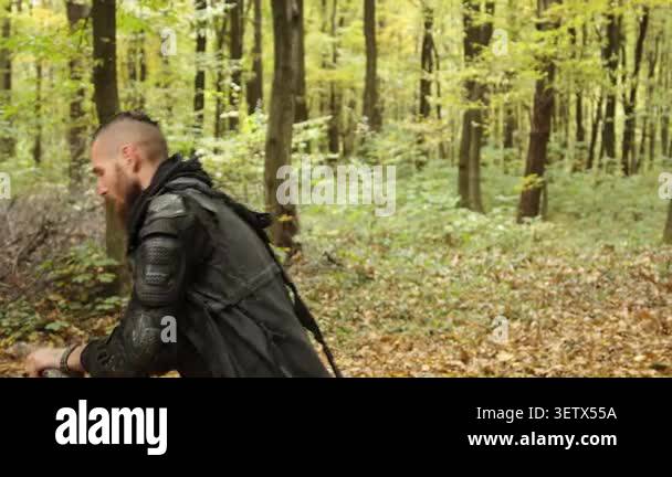 Nordic warrior, Black attire, Autumn warrior. In autumnal forest ...
