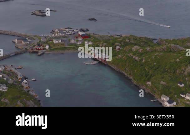 Scenic aerial footage of a picturesque Lofoten fishing village nestled ...