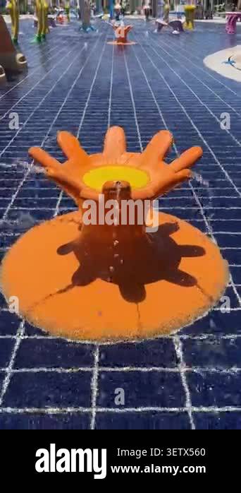 Colorful children's splash pad with playful water features on June 20 ...