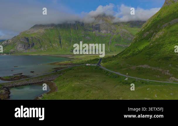 Sweeping aerial footage of Lofoten Islands dramatic mountainous terrain ...