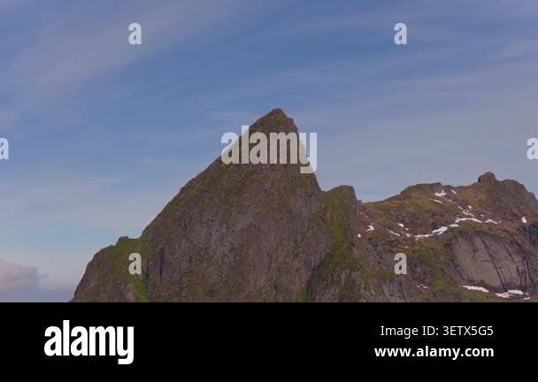 Stunning aerial view of jagged mountain peaks in Lofoten, Norway. Moss ...