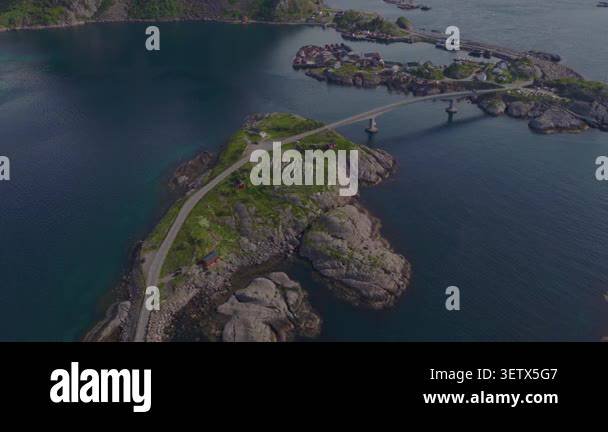 Stunning aerial drone footage of a scenic rocky island connected by a ...