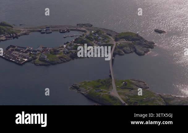 Aerial drone footage of Lofoten Islands in Norway featuring a winding ...