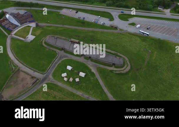 Drone footage of Lofoten Islands settlement showing modern parking ...