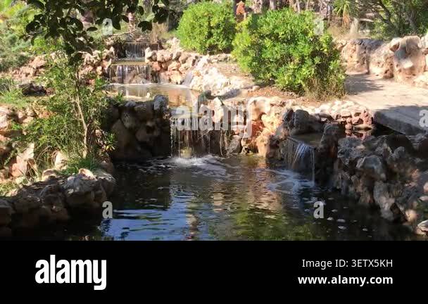 An artificial stream with small waterfalls in Parque del Oeste (Oeste ...