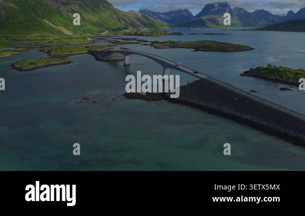 Stunning aerial drone footage of a modern bridge spanning turquoise ...