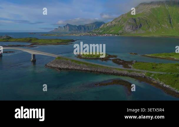 Stunning aerial footage of a modern bridge spanning crystalline ...