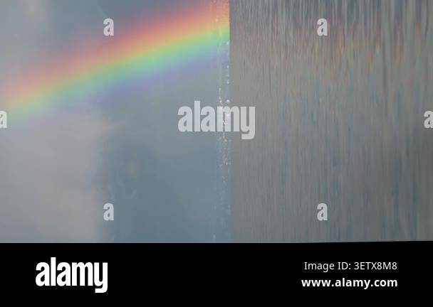 Real Time Rainbow over Lake Geneva and mountain in cloudy day ...