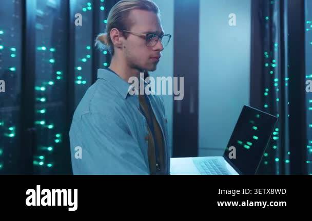 The video features a professional woman in a modern server room, using ...