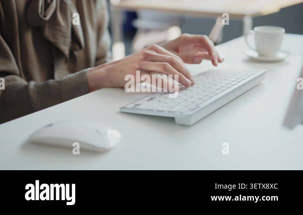 Close up shot of female hands typing on computer keyboard, surfing ...