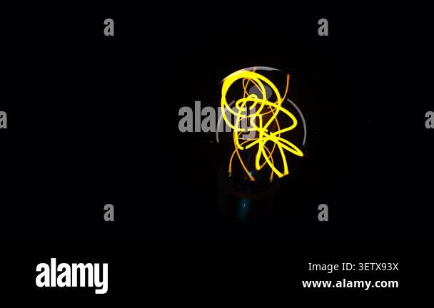 Cinematic crane drop from high above the light bulb to the titanium ...