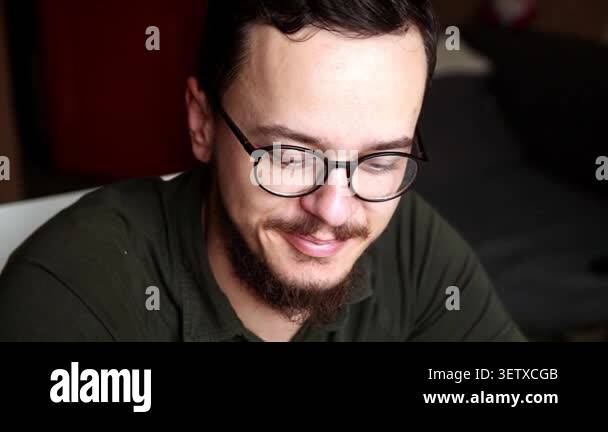 Man smiling with glasses looking at camera close up. Portrait of happy ...