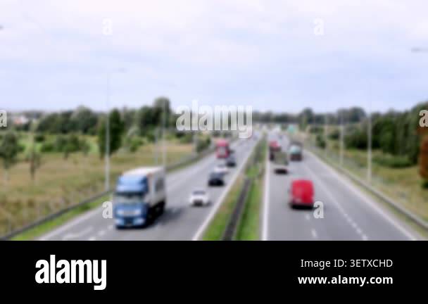Highway traffic blur timelapse with cars and trucks. Out of focus tilt ...