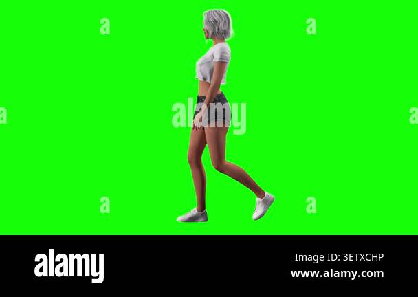 Woman walking with confident casual catwalk motion on green screen ...
