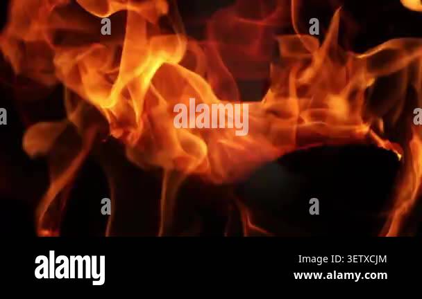Fire flames with flying sparks close up. Abstract texture of blazing ...