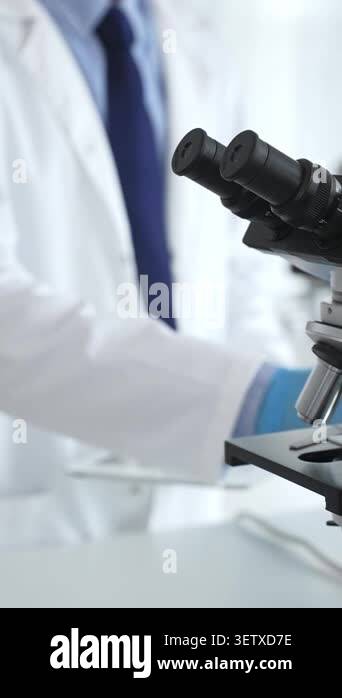 Microscope stands on laboratory table ready for innovative medical ...