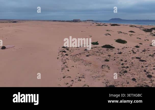 Drone flight over vast sand dunes near Corralejo Natural Park in ...