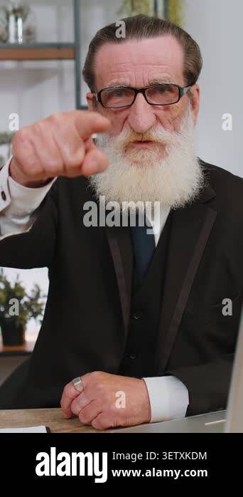 I choose you. Elderly businessman programmer software developer working ...