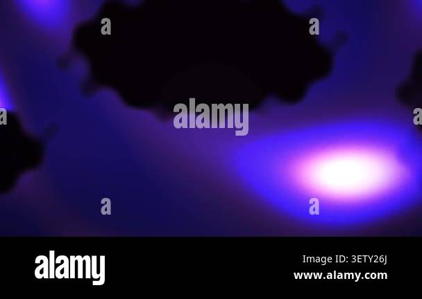 Glowing particles or cells under a microscope in a dark background with ...