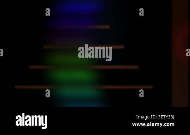 Vibrant spectrum light beam projection on a dark background Stock Video ...