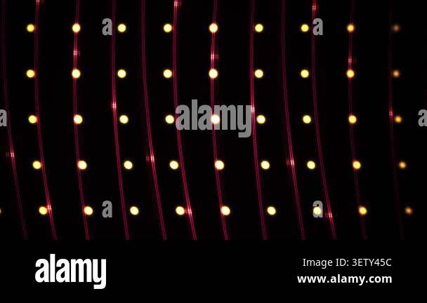 A series of glowing string lights on a dark background, creating a ...