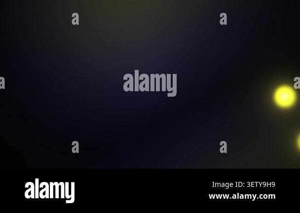 Glowing yellow lights against a dark background, creating a sense of ...