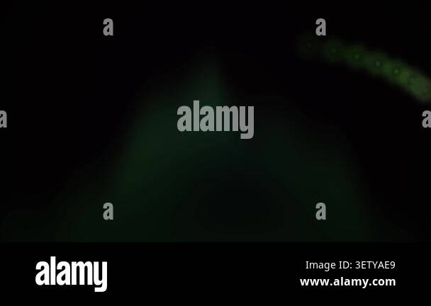 A dark scene with blurry lights and a greenish hue Stock Video Footage ...