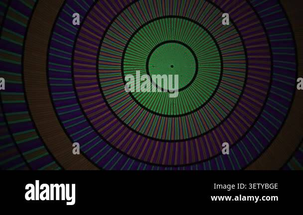 A vibrant multicolored concentric circles pattern with green center ...