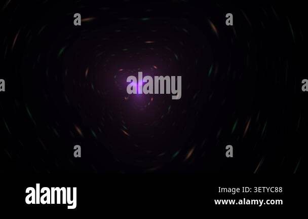 A purple light shines brightly in a black background surrounded by ...