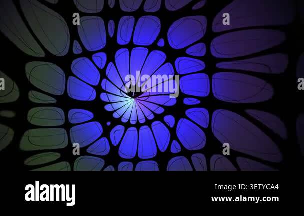 A stained glass window with a flower-like design in shades of blue and ...